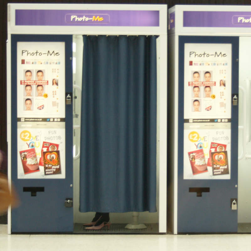 installation of legs in a photo booth in Central Station, Glasgow ...