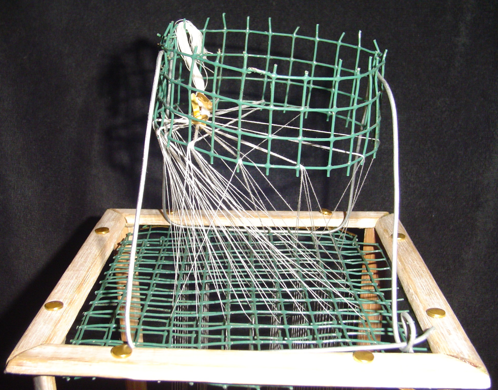 Kinetic sculpture of water ripple, using pins and thread - Bertie Pleass