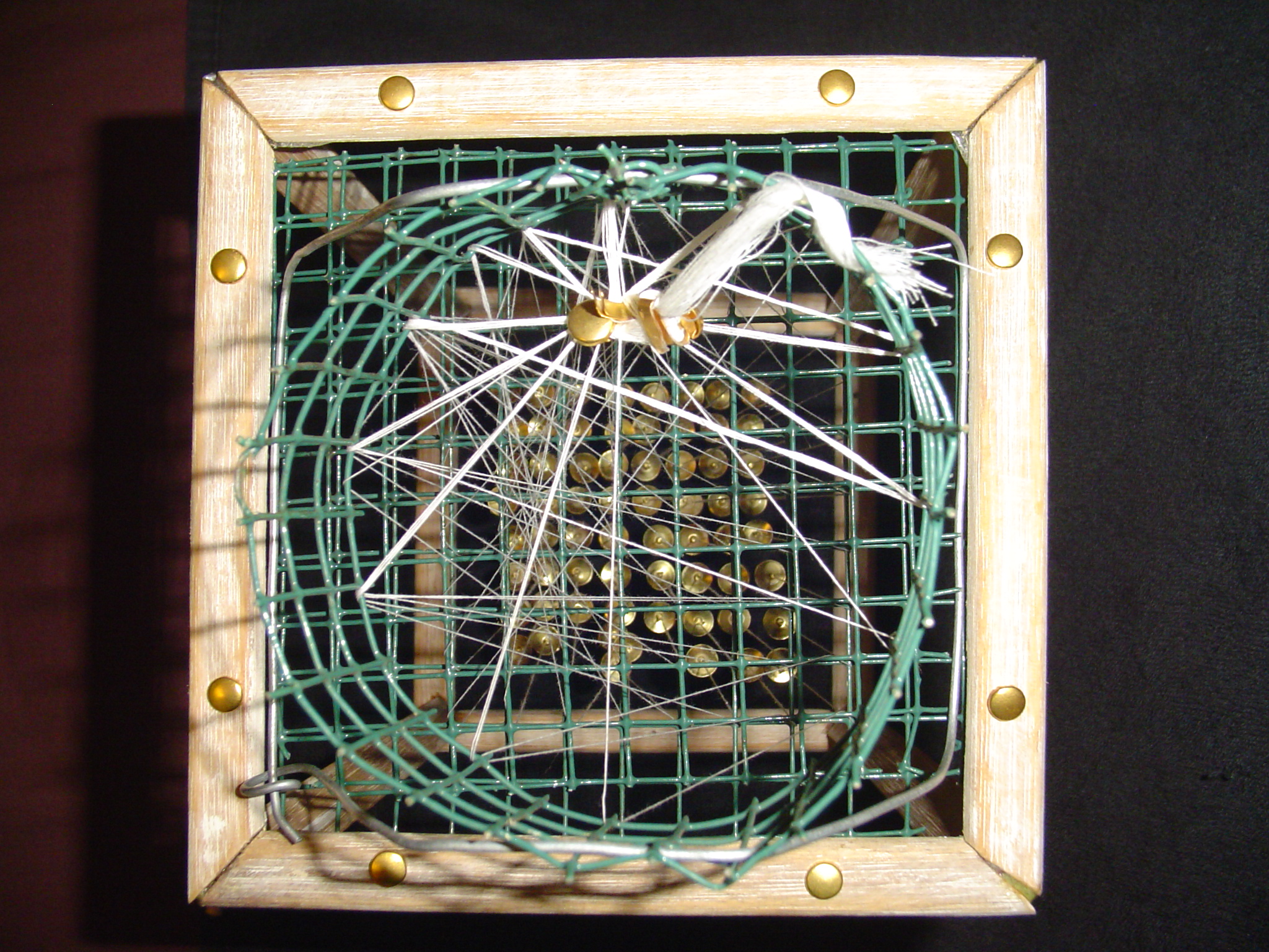 Kinetic sculpture of water ripple, using pins and thread - Bertie Pleass