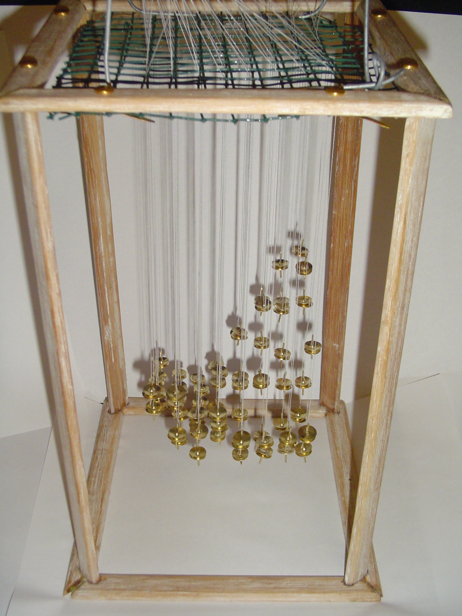 Kinetic sculpture of water ripple, using pins and thread - Bertie Pleass