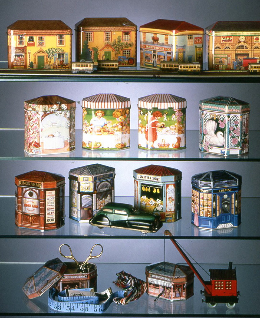 ranges of tins with "roof" lids - ian-logan-design-tins